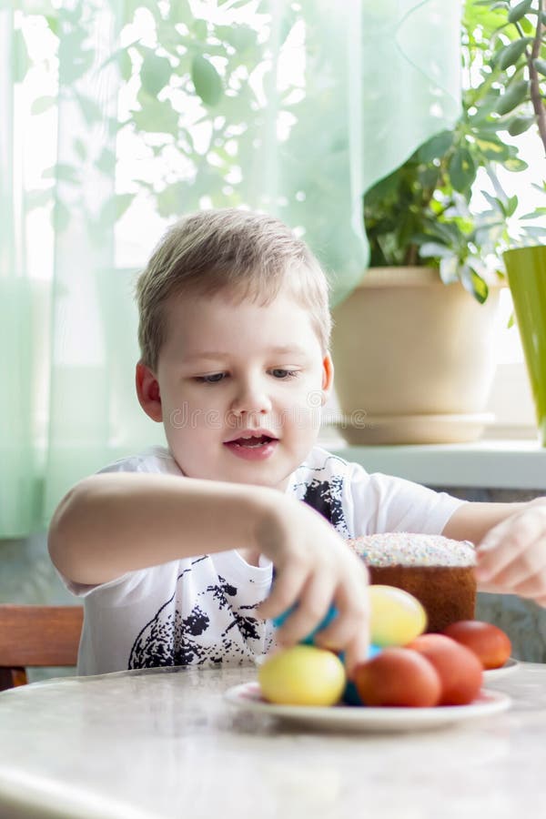 Portrait of a Cute Child with Easter Eggs. Easter Lunch Stock Image ...