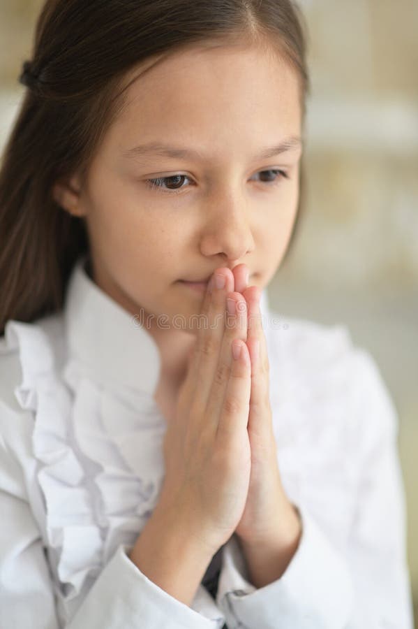 Portrait of a Cute Girl Praying at Home Stock Photo - Image of person ...