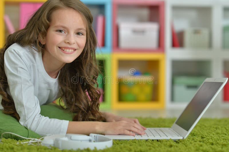 Portrait of Cute Girl Using Laptop on Floor Stock Image - Image of ...