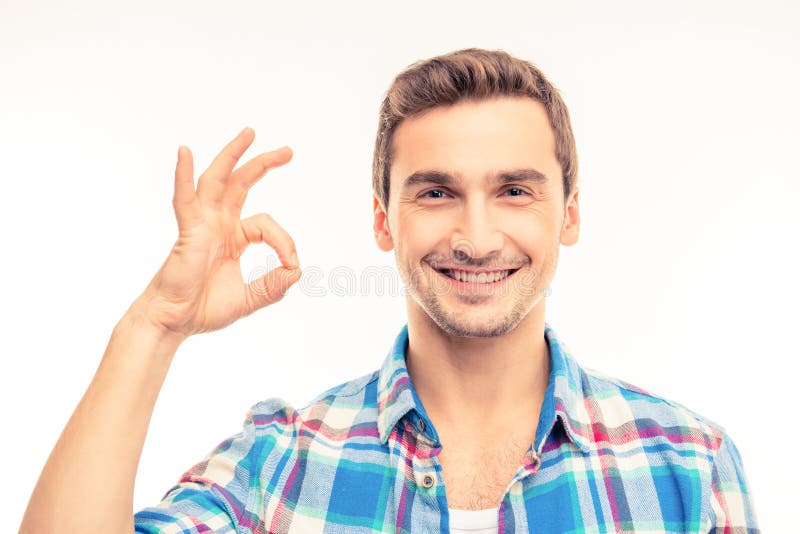 Portrait of a Cute Handsome Young Man Gesturing Ok Stock Photo - Image ...