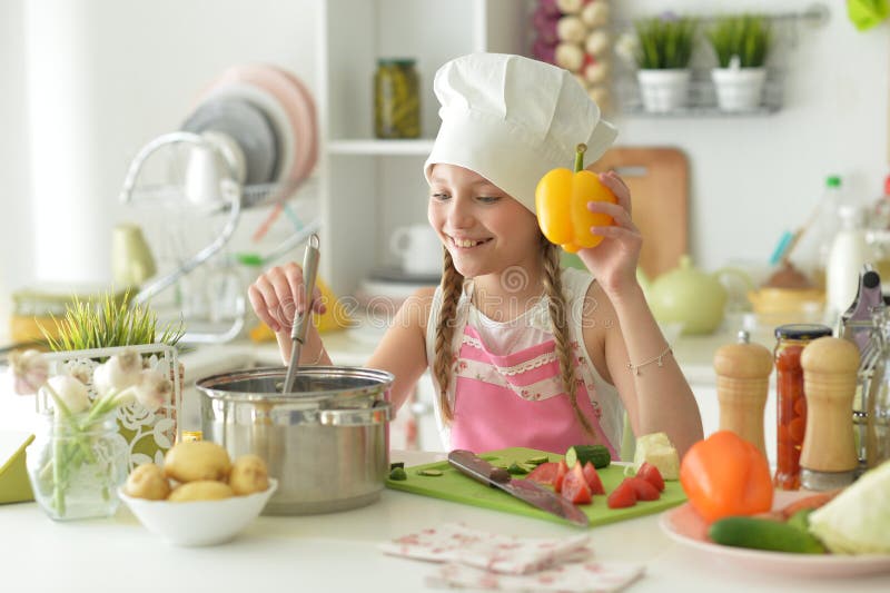 Portrait of Cute Happy Girl Coocking on Kitchen Stock Photo - Image of ...