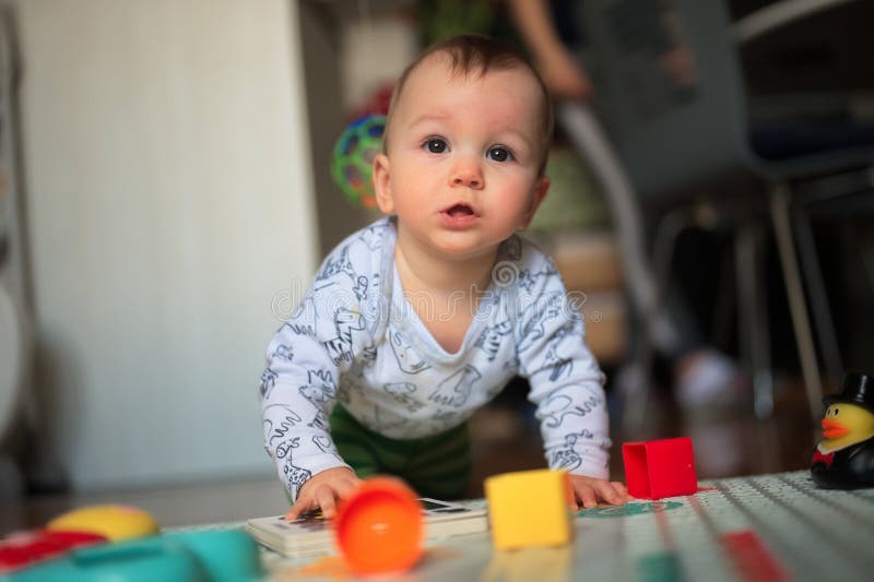 Cute little baby playing stock photo. Image of innocence - 259069622