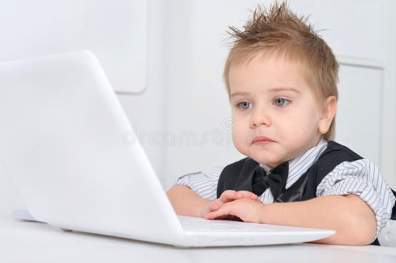 Little Boy with Computer Sitting Stock Image - Image of internet ...
