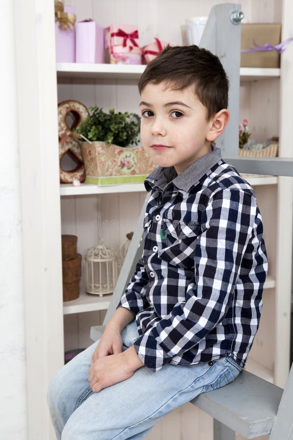 Portrait of a Cute Little Boy Sitting on the Staircase Stock Photo ...
