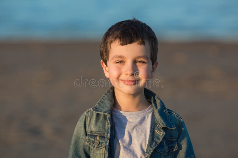 Portrait of a Cute Little Boy Smiles in Denim in the Evening Stock ...