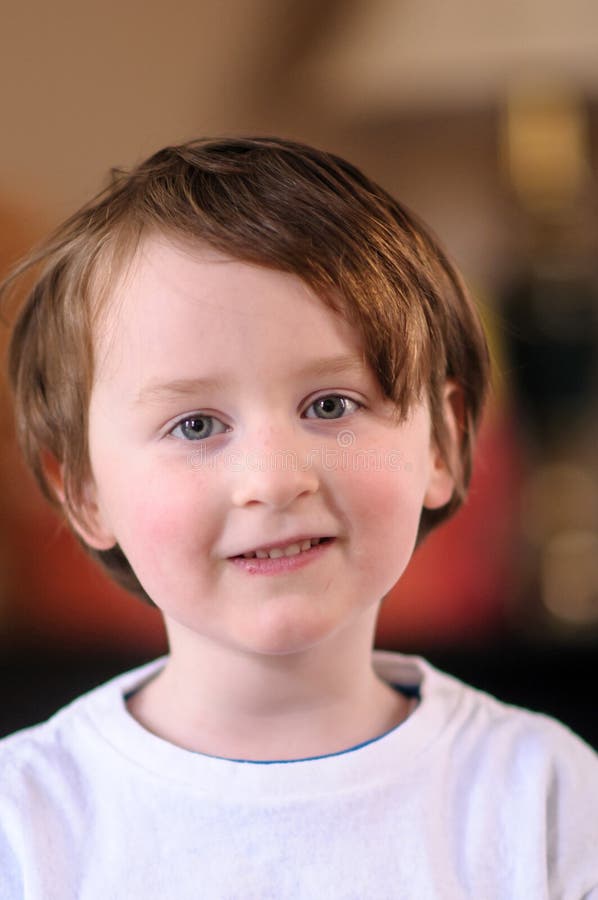 Portrait of a Cute Little Boy Smiling Indoors Stock Photo - Image of ...