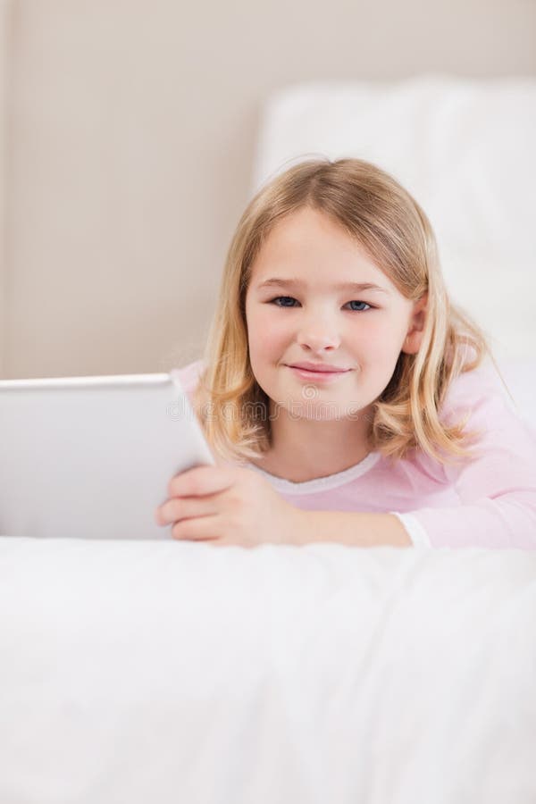 Portrait of a Cute Little Girl Using a Tablet Computer Stock Photo ...