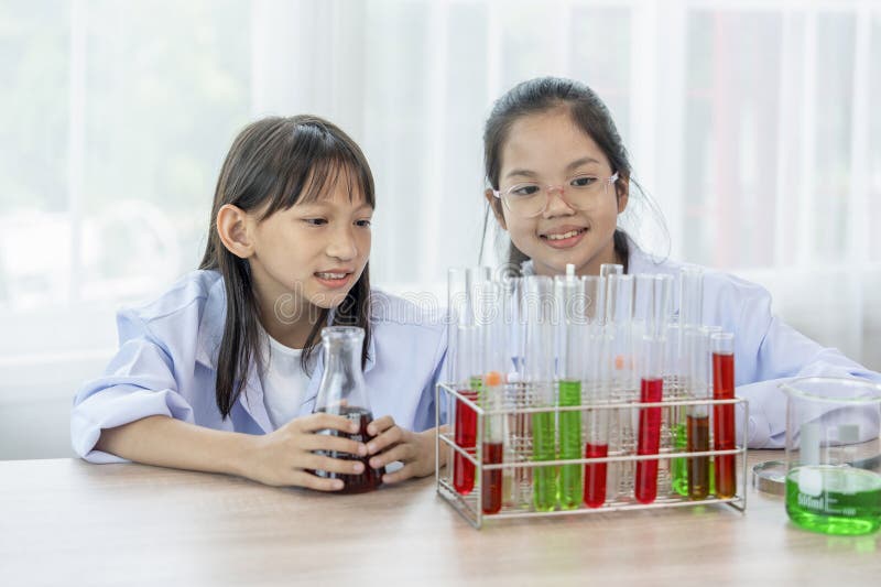 Portrait Cute School Girls in Lab Coat Enjoy Learning Science in the ...
