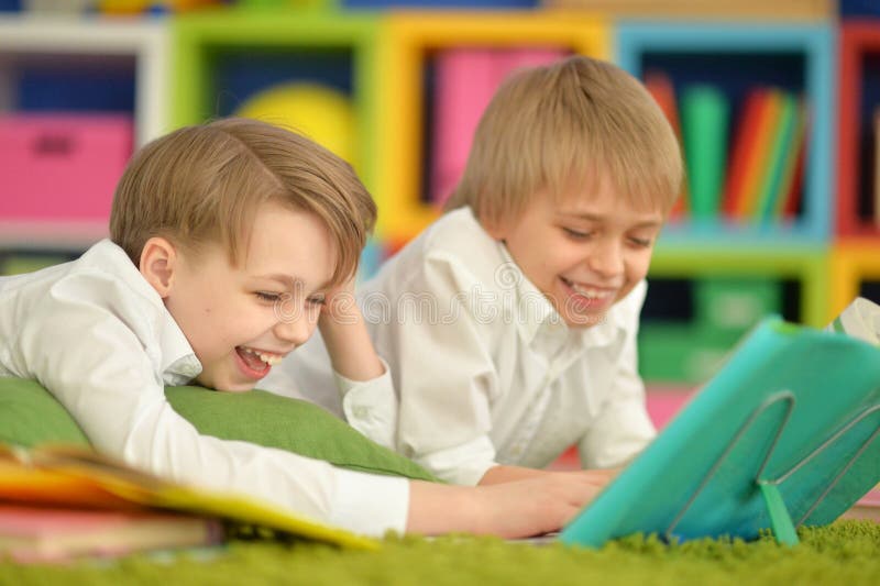 Two boys reading stock photo. Image of success, white - 22294532