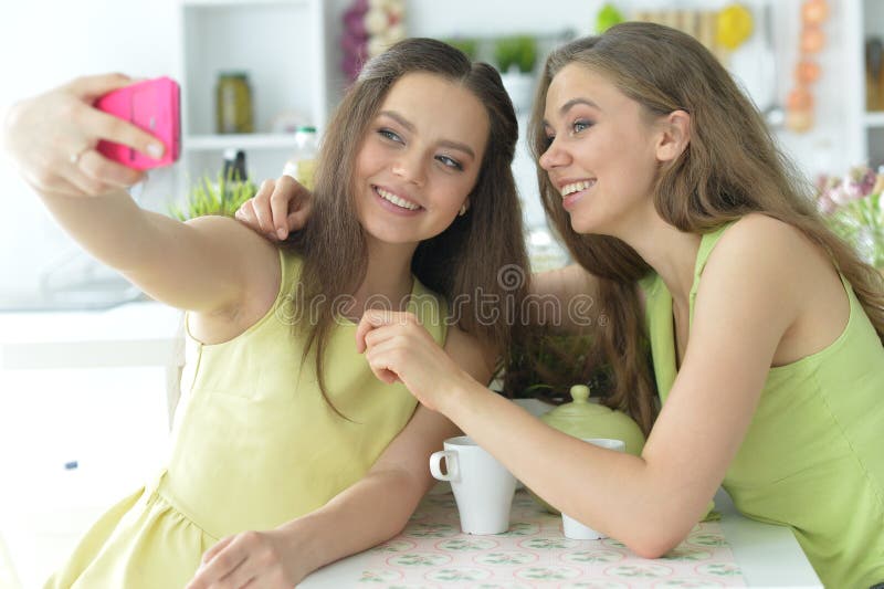 Portrait Of Two Girls Taking Selfie With Phone Stock Image Image Of