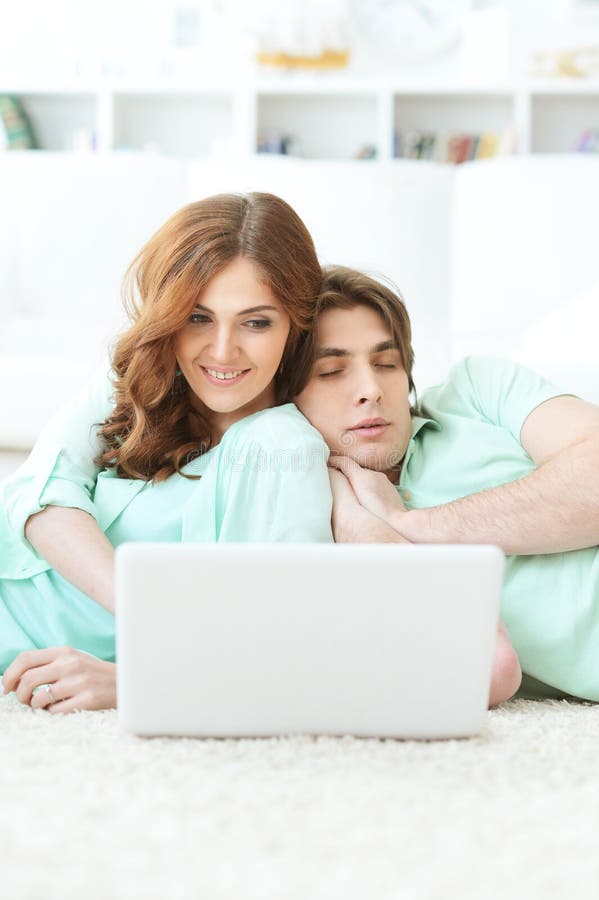 Portrait of Cute Young Couple Using Laptop Stock Photo - Image of ...