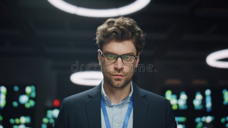 Portrait Data Center Engineer Posing at Database. Serious Man Looking ...