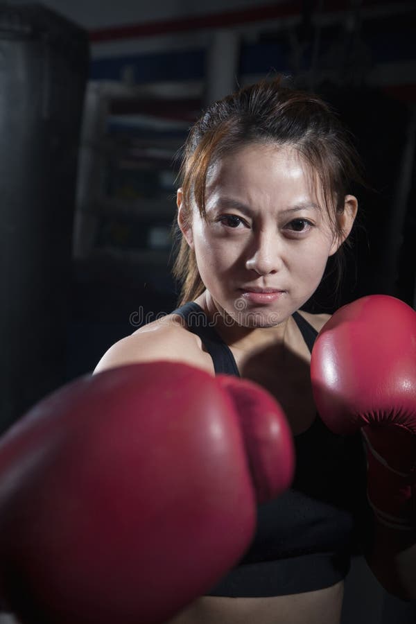 Over the Shoulder View of Two Female Boxers Boxing in the Boxing Ring ...
