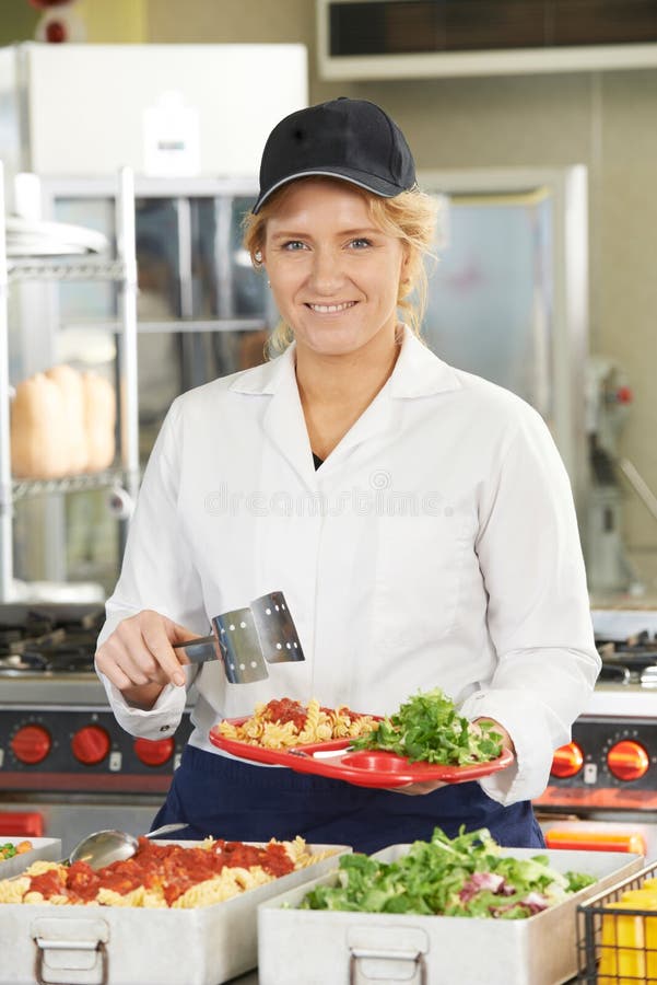 Portrait of Dinner Lady Serving Meal in School Cafeteria Stock Photo ...