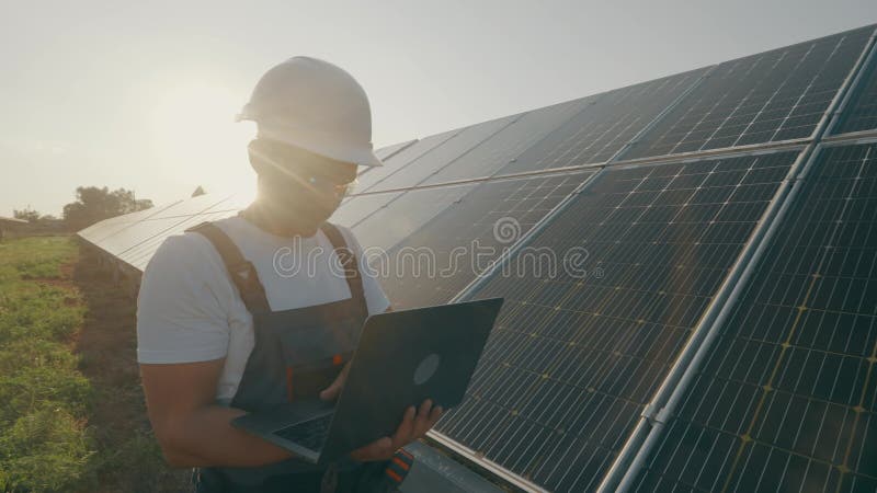 A Renewable Energy Specialist Checks the Efficiency of Solar Panels ...