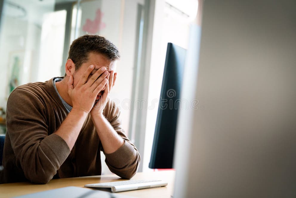 Portrait of a Disappointed Man Programmer Looking Stressed Out while ...