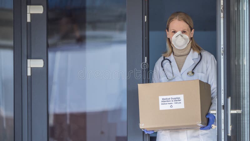 Portrait of a Doctor with a Box of Protective Medical Masks. Stock ...