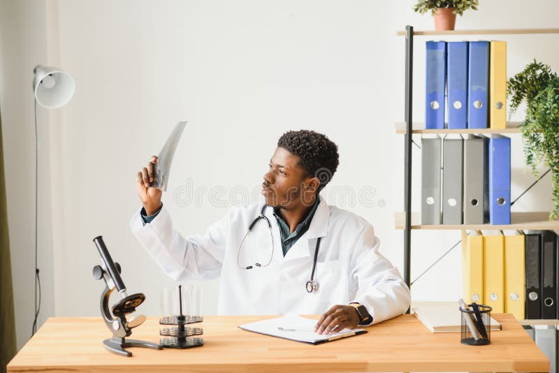 Portrait of Doctor Checking on X-ray Results. Stock Image - Image of ...