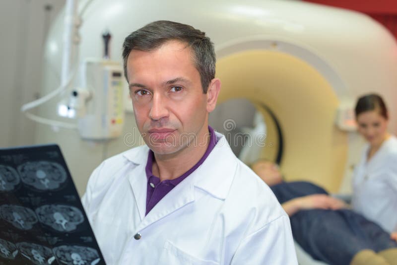 Portrait Doctor Holding Xrays Mri Scanner in Background Stock Photo ...