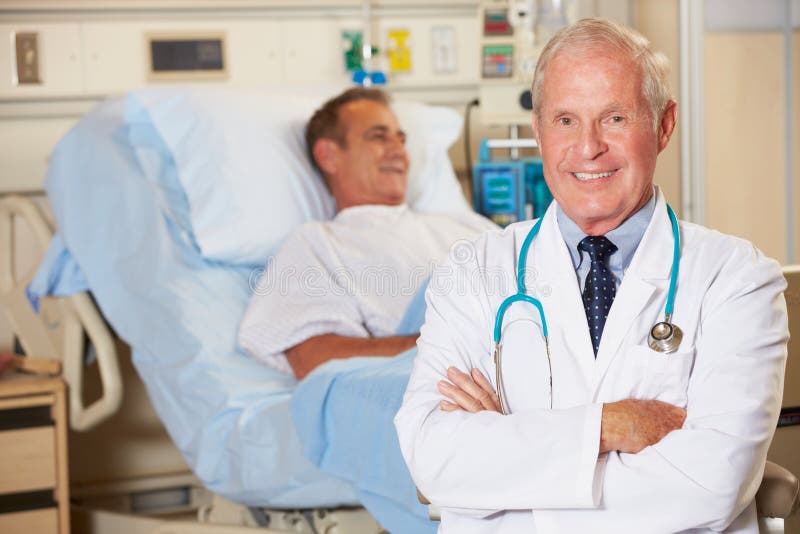 Portrait of Doctor with Patient in Background Stock Photo - Image of ...