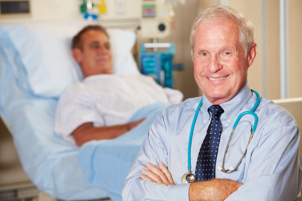 Portrait of Doctor with Patient in Background Stock Photo - Image of ...