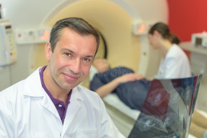 Portrait Doctor by Scanning Machine Stock Photo - Image of radiology ...