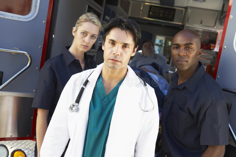 Paramedics and Doctor Unloading Patient Stock Photo - Image of people ...