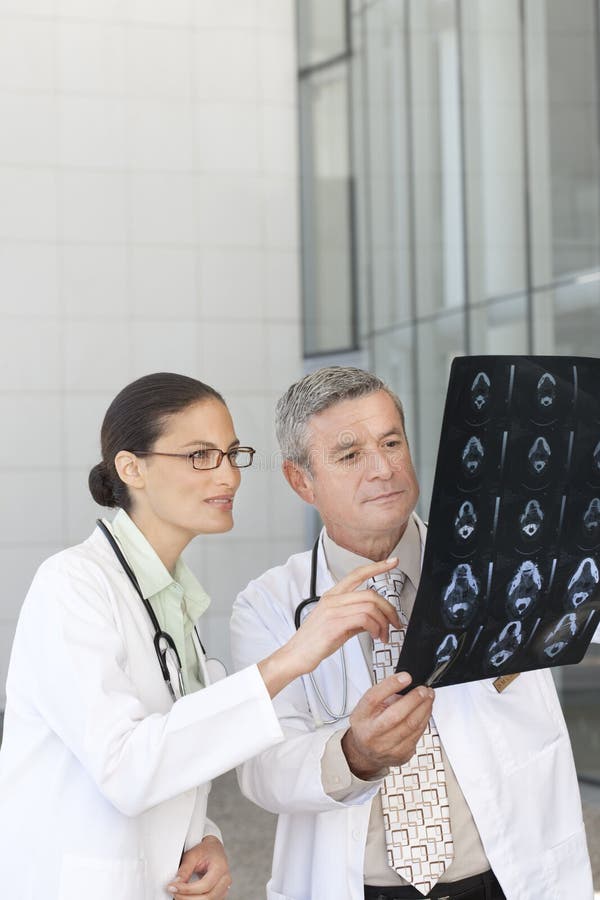 Multiethnic Medical Research Team Working at Desk Stock Image - Image ...