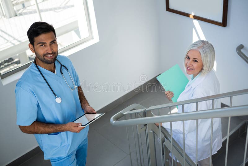 Portrait of Doctors Smiling while Standing on Staircase Stock Image ...
