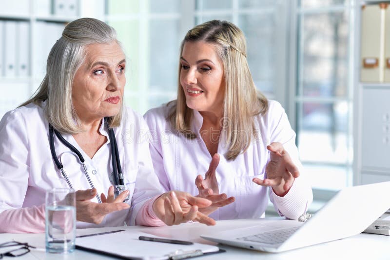 Portrait of Doctors at Work in Hospital Stock Image - Image of smiling ...