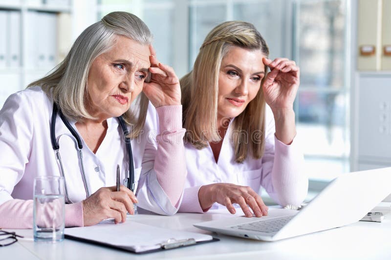 Portrait of Doctors at Work in Hospital Stock Image - Image of women ...