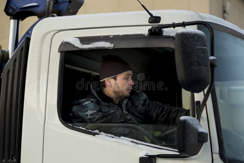 Driver in a Cab Driving a Truck Stock Photo - Image of hand, smile ...