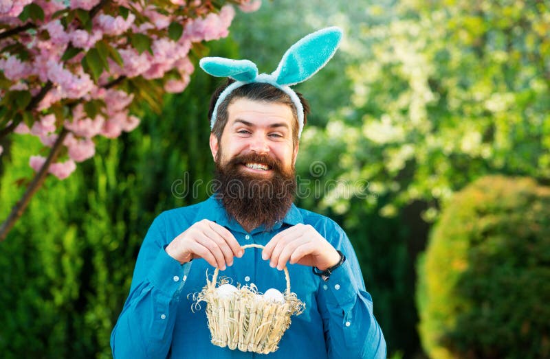Portrait of Easter Man Hunting Eggs. Man in Bunny Ears Holds Basket ...
