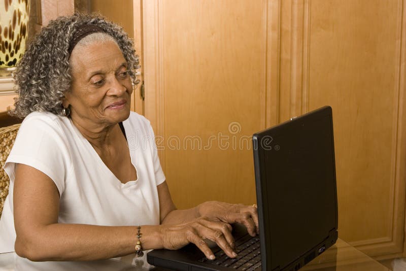 Portrait of an Elderly African American Woman on Her Computer. Stock ...