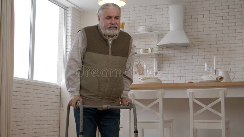 Portrait of Elderly Man with Mobility Disability Using Walker for Walk ...