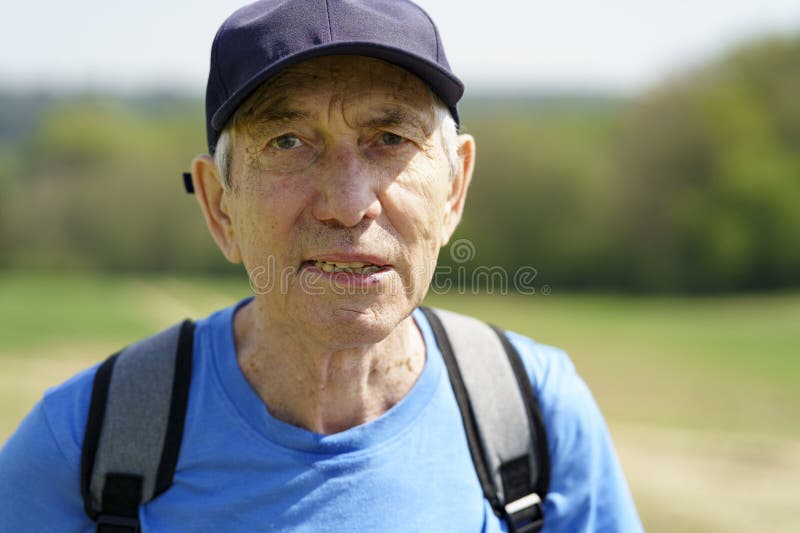 Portrait of an Elderly Man in a Cap and Plaid Shirt Stock Photo - Image ...