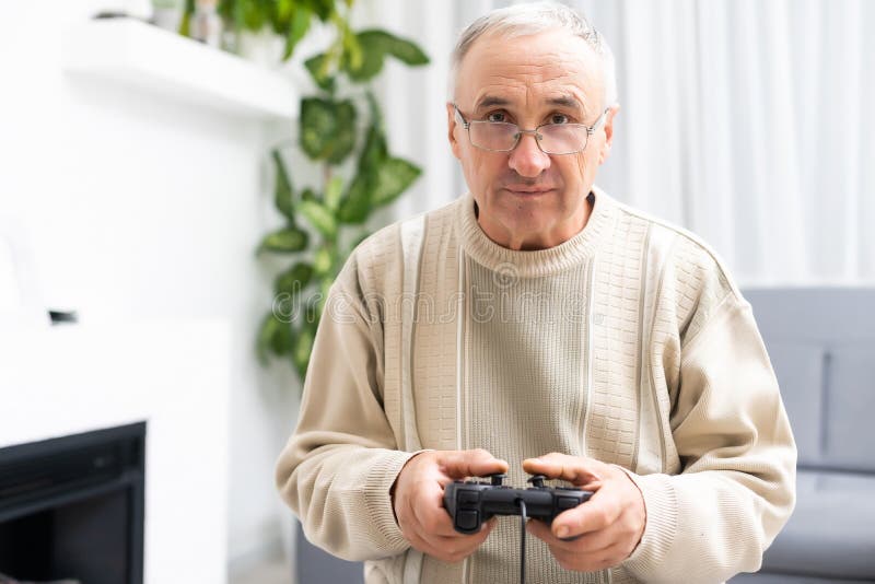 Portrait of Elderly Man Playing Video Games with Joystick Stock Photo ...