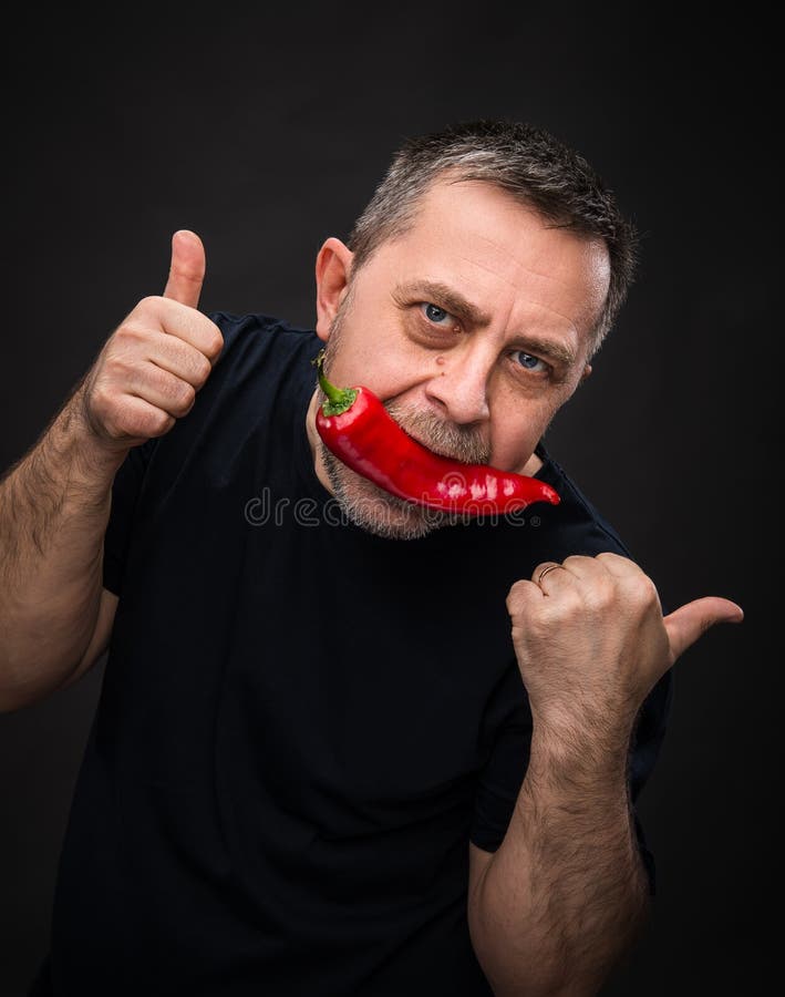 Elderly Man with Red Pepper in His Mouth Stock Image - Image of ...