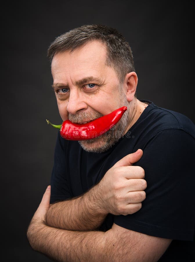 Elderly Man with Red Pepper in His Mouth Stock Image - Image of ...