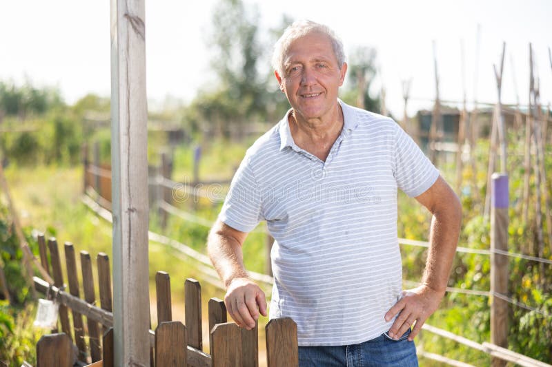 Portrait of an Elderly Owner of Village Farm with Tools in His Hands ...