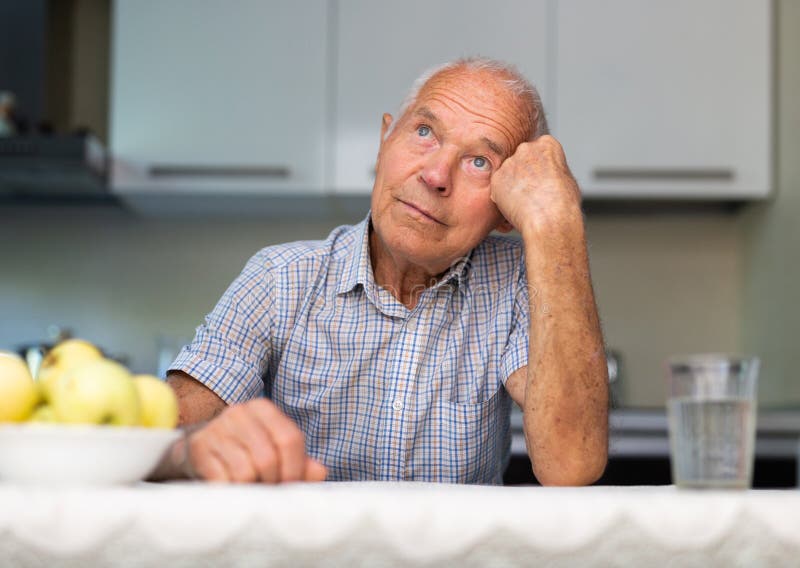 Portrait the Elderly Positive Man Sits at Table in Kitchen Stock Image ...