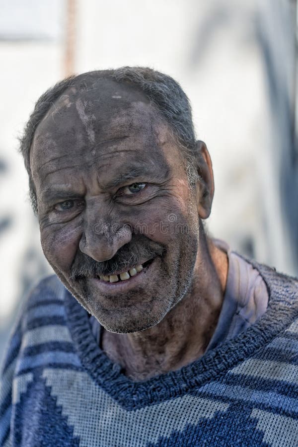 Elderly Smiling Man with a Face in Black Dust Stock Image - Image of ...