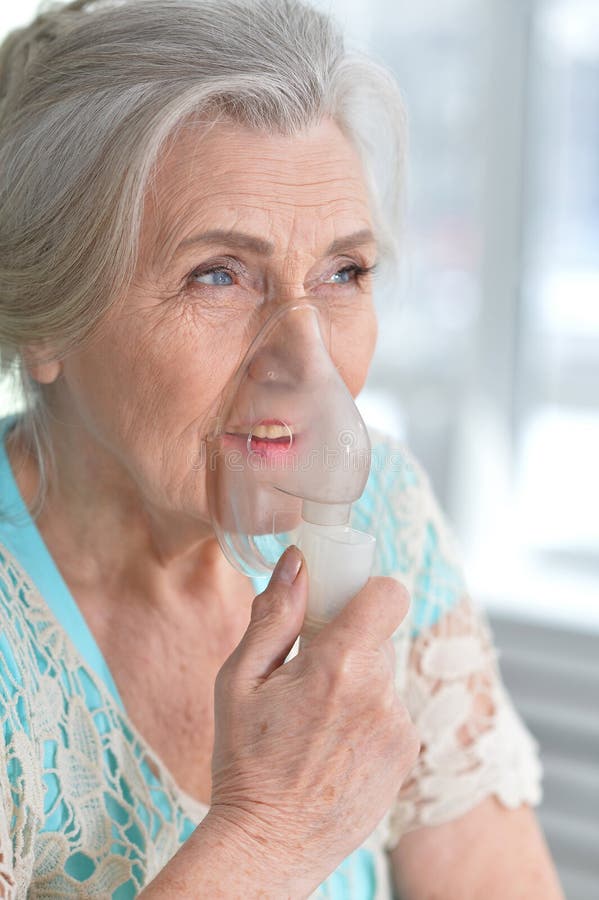 Portrait of an Elderly Woman Using an Inhaler Stock Image - Image of ...