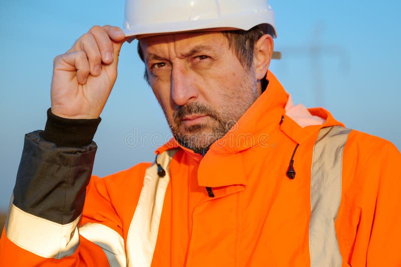 Portrait of Electrical Engineer in Field Wearing High Visibility Jacket ...
