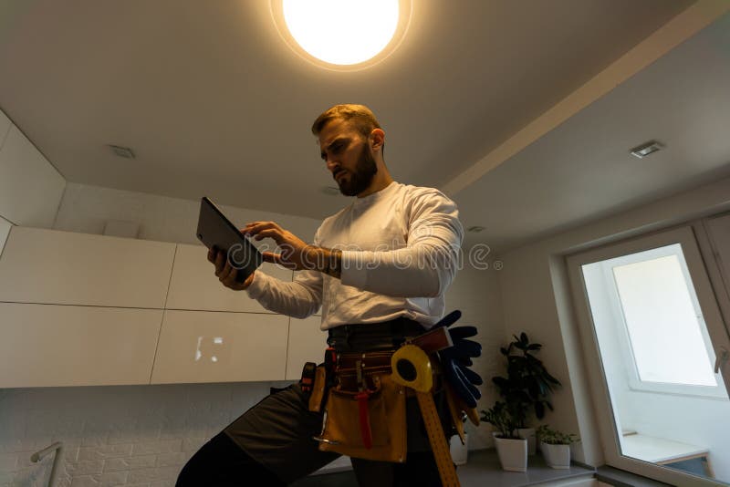 Portrait of an Electrician Using His Tablet Computer Stock Image ...