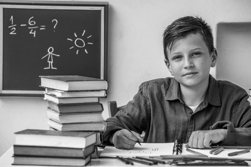 Portrait of Elementary School Student Doing Homework. Black and White ...
