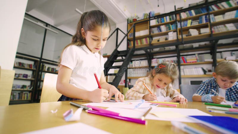 Portrait of an Elementary School Student Sitting at the Front Desk ...