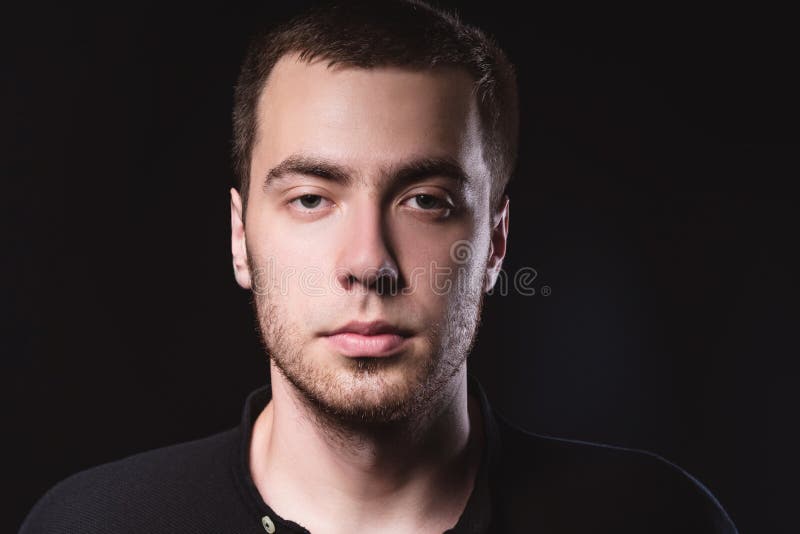 Handsome and Brooding. Portrait of a Brooding Man Standing Against a ...