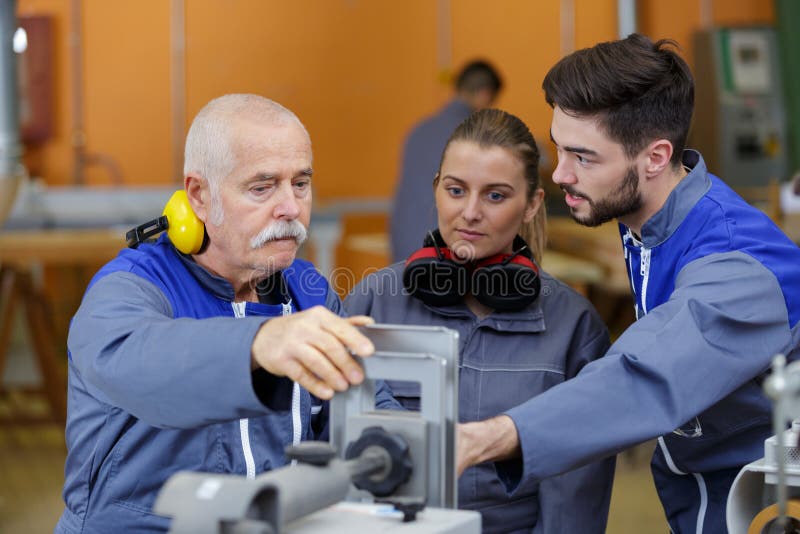 Engineer and Apprentice Using Automated Milling Machine Stock Image ...