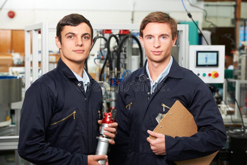 Portrait of Engineer and Apprentice in Factory Stock Image - Image of ...